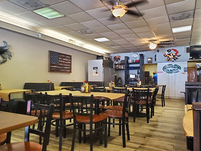 Simple tables, ceiling fans, and maritime décor create the perfect backdrop for crab feasts. This isn't about ambiance—it's about keeping your focus where it belongs: on the food.