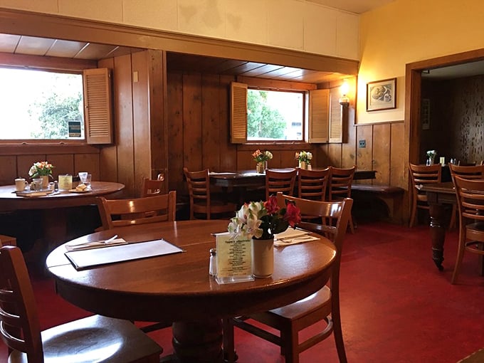 Step inside and time slows down. Wood-paneled walls, red floors, and simple tables create the kind of authentic atmosphere money can't manufacture.