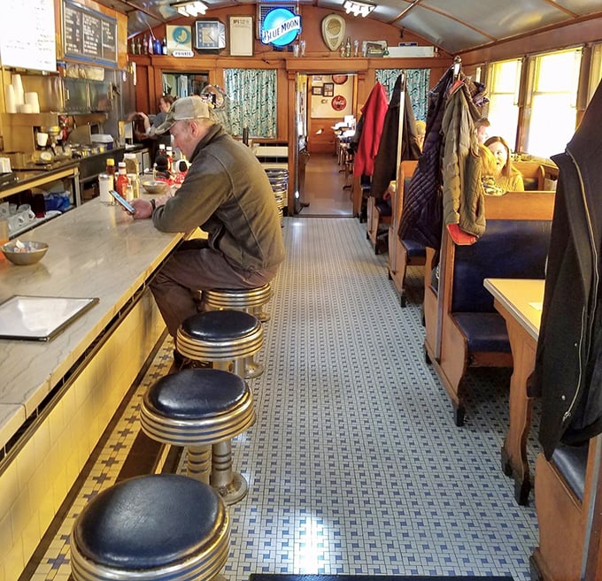 Inside, time stands still in the best possible way—chrome stools, narrow walkway, and wood paneling create that authentic Worcester Lunch Car Company charm that no modern restaurant can replicate.