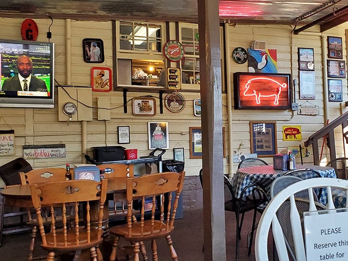 Inside, the walls tell stories of barbecue triumphs past, while that neon pig sign silently promises delicious things to come.