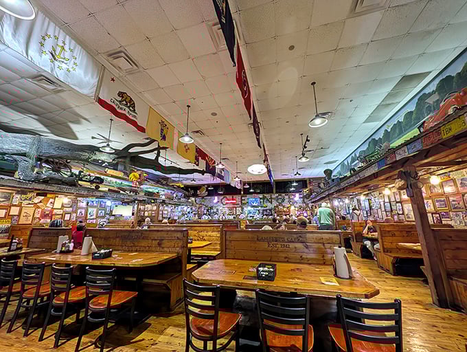 Step inside Lambert's and you're greeted by a museum of Americana—flags, memorabilia, and wooden booths that have witnessed countless flying bread incidents.