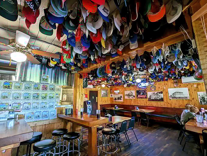 Baseball caps by the thousands create a colorful canopy overhead. It's like walking into your eccentric uncle's man cave—if your uncle collected headwear from everyone in Oregon.