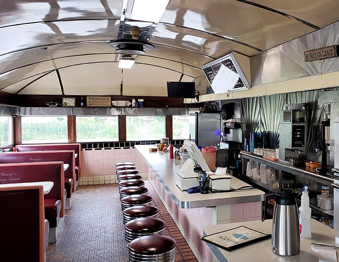 Step inside and you're transported to the golden age of diners – curved ceiling, burgundy stools, and a counter that's witnessed more morning coffee confessions than a priest.