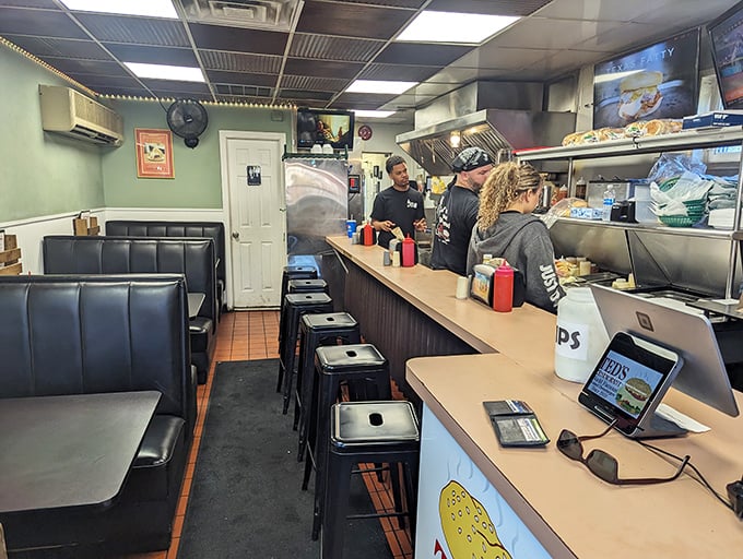 Inside Ted's, the counter seating puts you front-row for the steamed burger spectacle—dinner and a show!