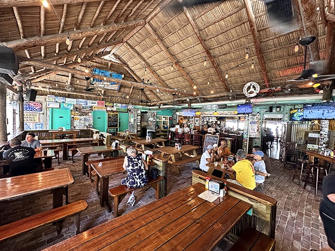The dining room feels like the world's best beach shack—wooden tables, license plates, and the promise of fresh-caught deliciousness.
