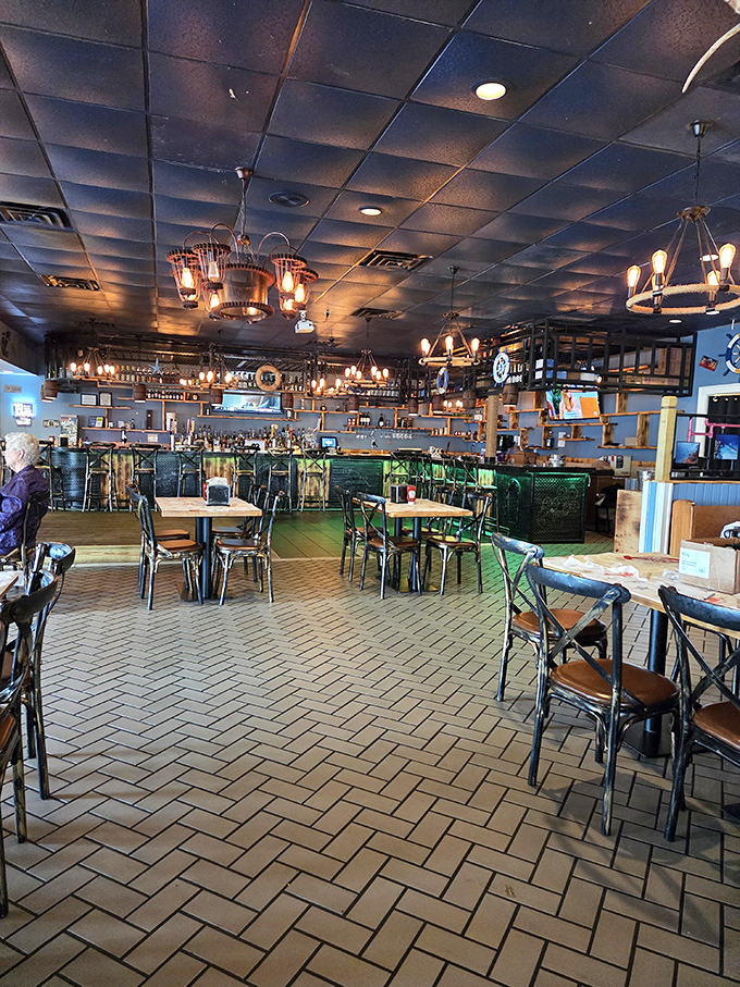 The herringbone brick floor and warm lighting create an atmosphere that says, "Leave your pretensions at the door—we're here for serious seafood business."