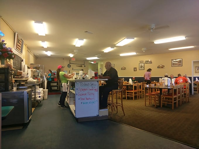Inside, the unpretentious dining area hums with the morning symphony of silverware, conversation, and the promise of comfort food done right.