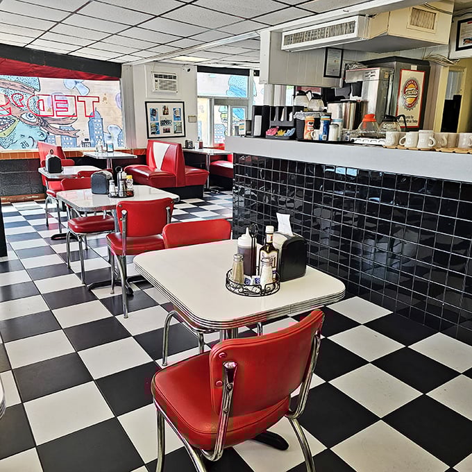 Classic red vinyl booths and checkerboard floors—this isn't retro by design, it's authentic by survival. Time travel never tasted so good.