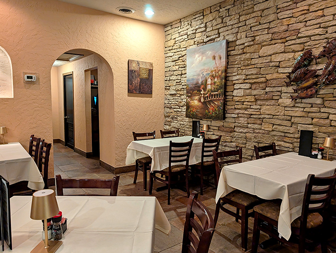 Stone walls and white tablecloths create that perfect sweet spot between "fancy enough for an anniversary" and "comfortable enough to actually enjoy your meal."