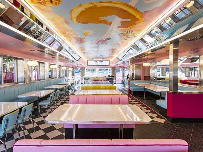 Stepping inside is like entering a 1950s dream sequence that got a Technicolor upgrade. Those egg murals on the ceiling? Pure breakfast whimsy.