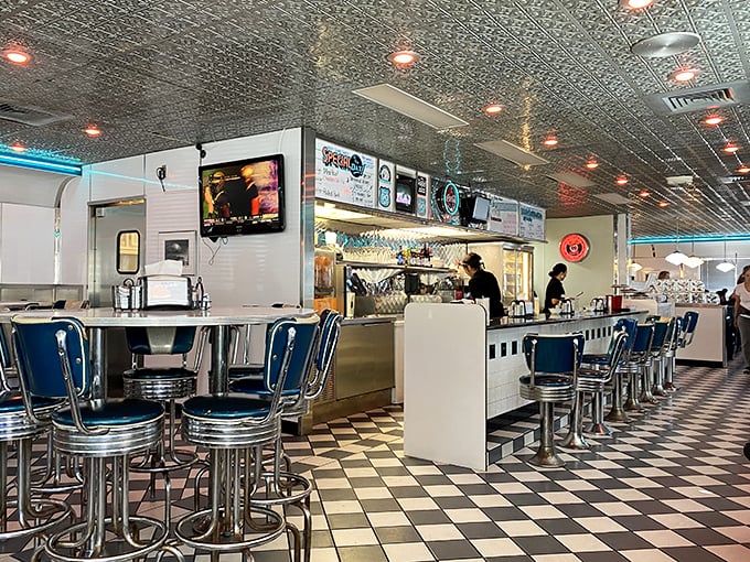 Blue vinyl stools and a checkered floor—this isn't interior design, it's a declaration that some traditions are worth preserving.