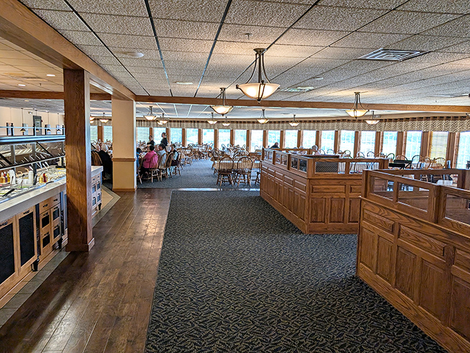 Warm wood tones and spacious seating create the perfect backdrop for family-style feasting, where conversations flow as freely as the coffee refills.