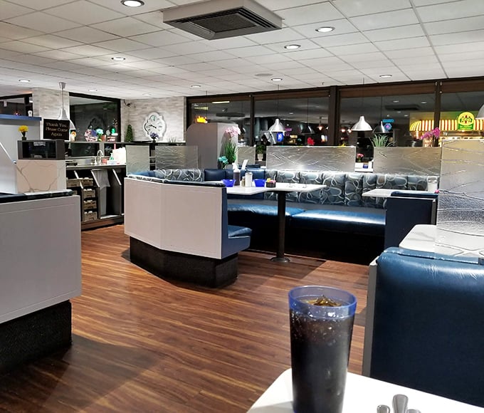 Blue booths and warm wood flooring create that perfect diner atmosphere—where everybody might not know your name yet, but they'll remember your order.