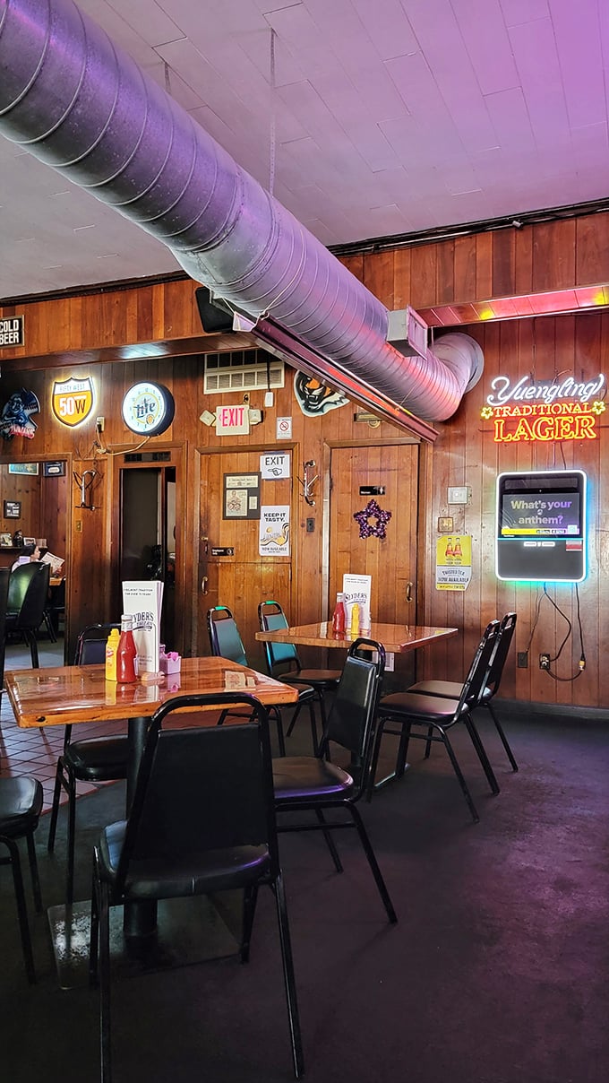 Wood-paneled walls and exposed ductwork create the perfect time capsule atmosphere—like dining in your favorite uncle's basement, but with better food.