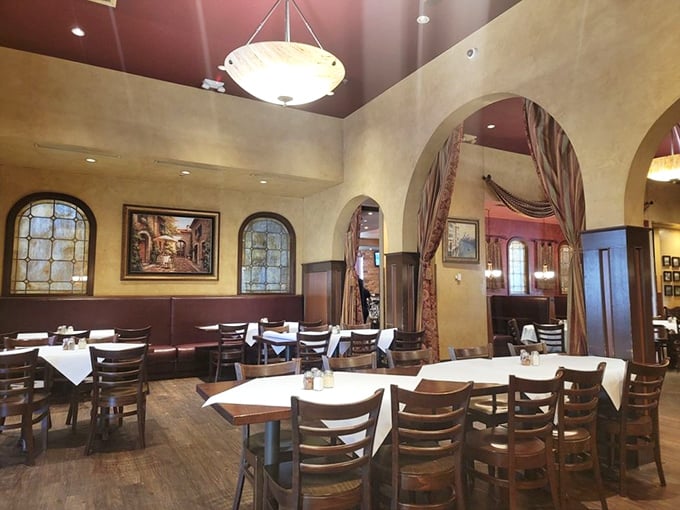 Step inside and time slows down – arched doorways, warm earth tones, and white tablecloths create that "Nonna's fancy dining room" atmosphere we all crave.