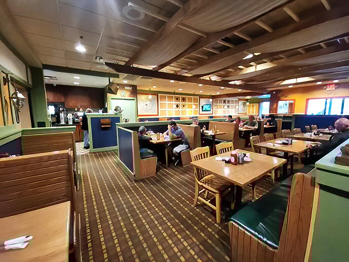 Where booths become thrones and every table feels like the best seat in the house. The warm wood tones and comfortable seating invite you to settle in.