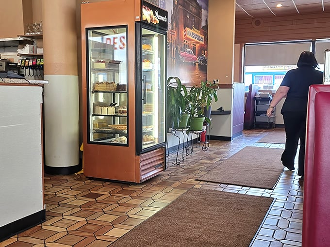 The dessert case stands guard near the entrance – a sweet sentry challenging your willpower before you've even ordered your eggs.