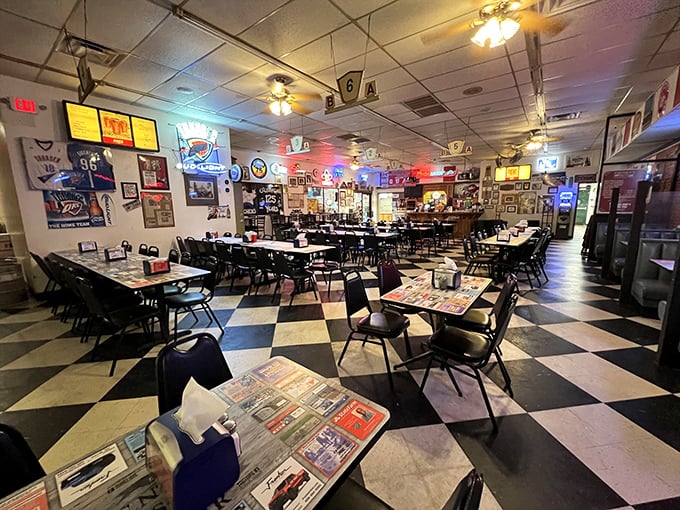 Black and white checkered floors, newspaper-covered tables, and walls of memorabilia – this isn't interior design, it's chicken-eating authenticity at its finest.