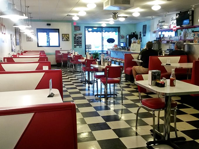 Step inside and time stands still – the black and white checkered floor and cherry-red booths are straight from the diner golden age.