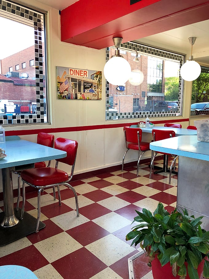 Red and white checkerboard floors, chrome-trimmed tables, and vinyl chairs—this isn't retro by design, it's authentic by survival.
