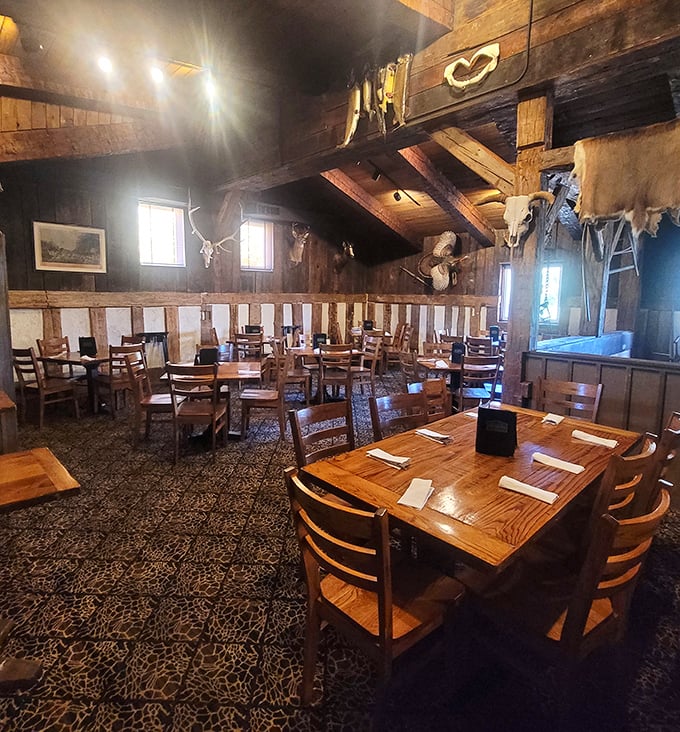 Exposed beams, hunting trophies, and wooden tables—this dining room has hosted more memorable meals than your grandmother's kitchen.