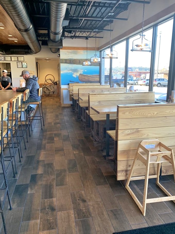 Modern rustic charm meets barbecue paradise inside, where wooden tables await the weight of trays loaded with smoky delights. 