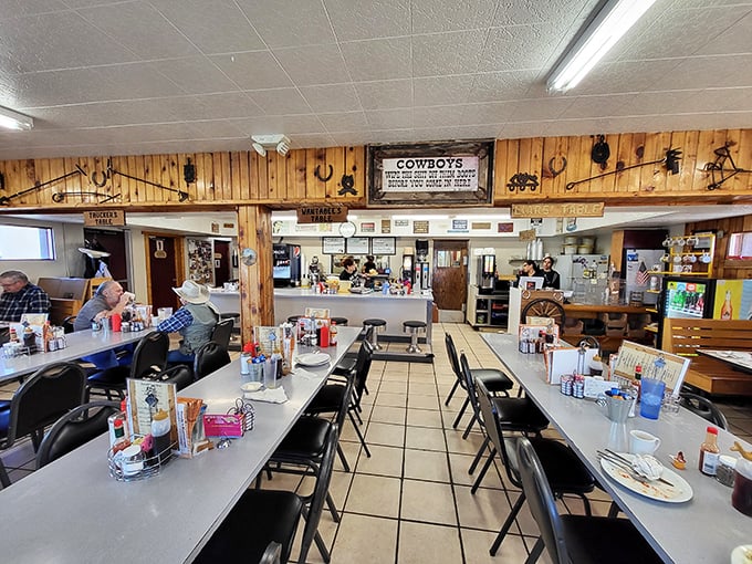Wood paneling and Western decor create the perfect backdrop for serious breakfast business. That "Cowboys" sign speaks the truth.