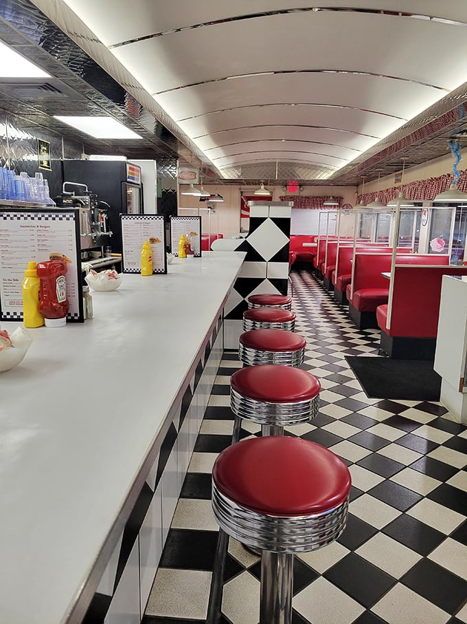 Classic red vinyl stools line up at the counter like eager patrons, while the checkered floor practically begs you to do the twist between bites of those famous biscuits.