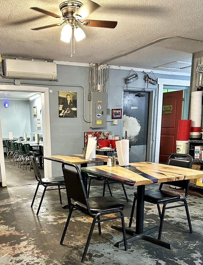 Simple wooden tables, ceiling fans, and zero pretension – this is where real Gulf Coast flavors take center stage, not fancy decor.