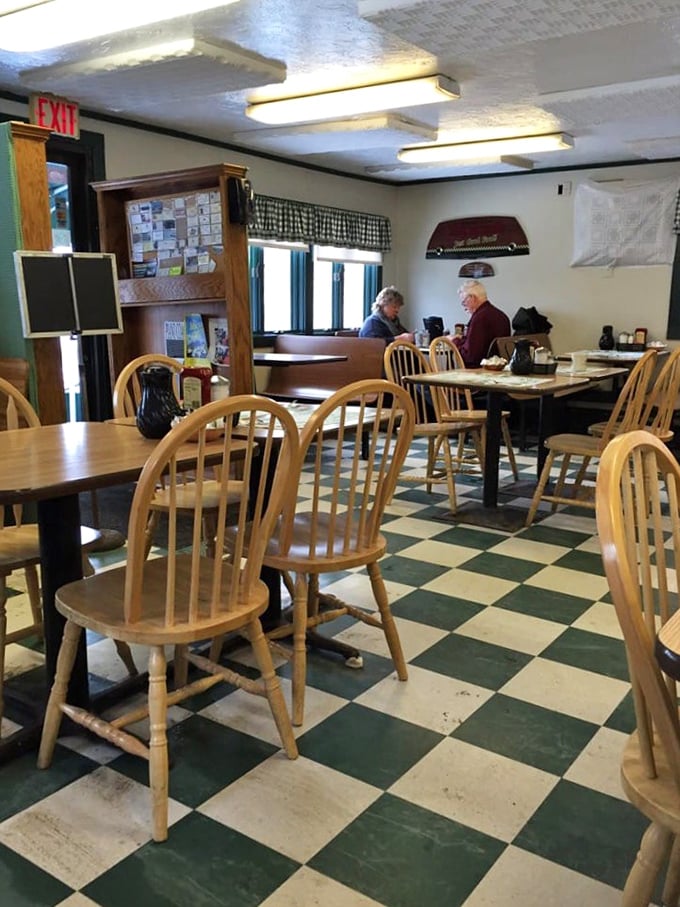 Classic checkered floors and Windsor chairs—the universal language of "sit down, relax, and prepare for comfort food that hugs your soul."