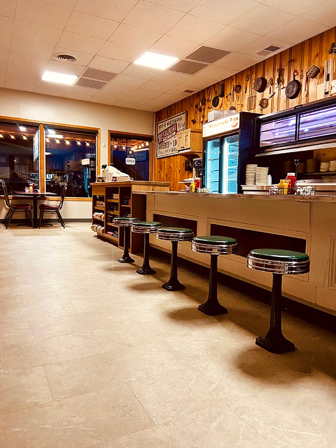 Those counter stools have witnessed more local gossip than a barber shop. The wood-paneled walls adorned with cast iron cookware scream "comfort food ahead!"