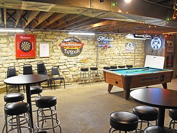 The basement level at Sally's features exposed stone walls, a pool table, and that perfect small-town vibe where everybody might not know your name—yet.