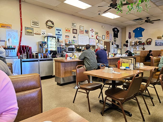 Classic diner ambiance with zero pretension. The kind of place where conversations flow as freely as the coffee, and regulars have their own unassigned-assigned seats.