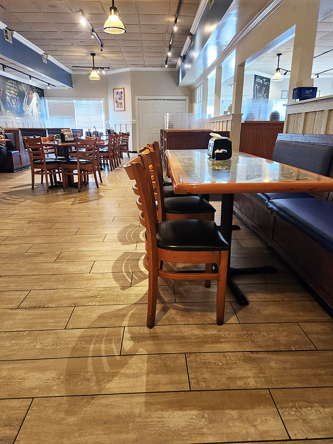 Wooden chairs, warm lighting, and an inviting layout – the dining room says "stay awhile" without having to say a word.