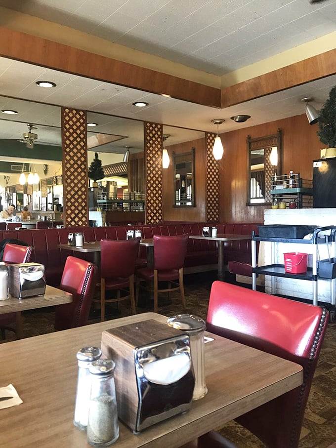 Red vinyl booths and wooden lattice dividers—not designed by some hipster firm, but preserved by decades of loyal customers who wouldn't change a thing.