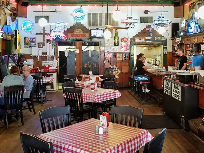Red and white checkered tablecloths aren't just decoration—they're a promise that what you're about to eat will taste like childhood memories, only better.