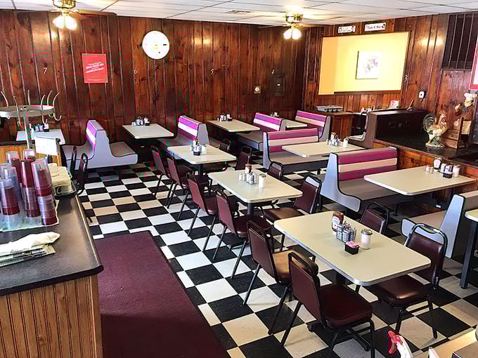 Wood paneling and checkerboard floors create the perfect time capsule. This isn't retro by design—it's authentic by survival.