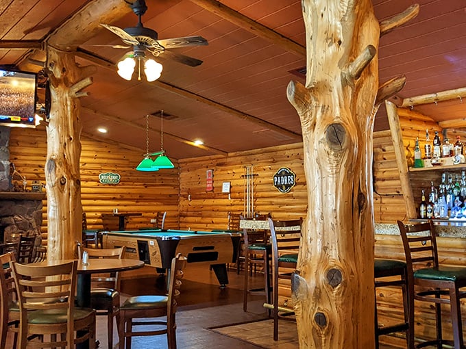 Those tree trunk columns aren't just supporting the ceiling—they're holding up generations of mountain cooking tradition. Nature meets nurture.
