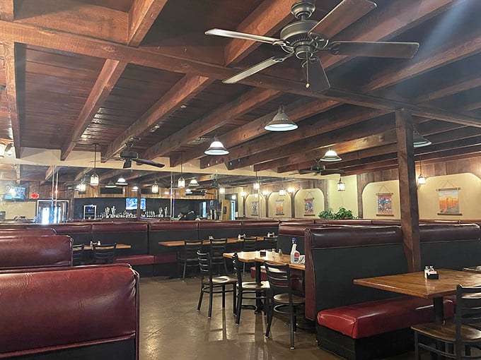 Wooden beams, red vinyl booths, and the promise of a memorable meal – Silver Saddle's interior feels like stepping into a steakhouse time capsule.