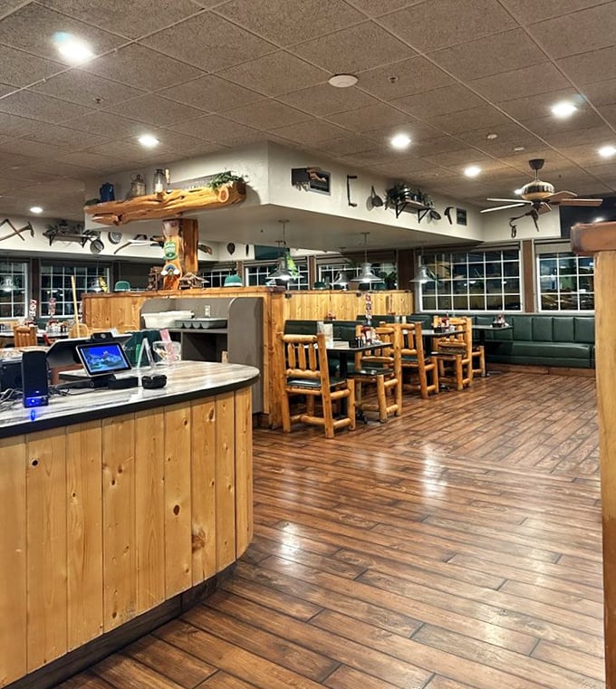 The interior embraces its woodland theme with warm wood tones and rustic charm – like dining in a luxury cabin without having to chop the firewood yourself.