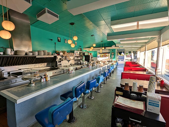 Step inside and you're transported to a simpler time—turquoise ceiling, blue counter stools, and red booths create the diner trifecta of perfection.