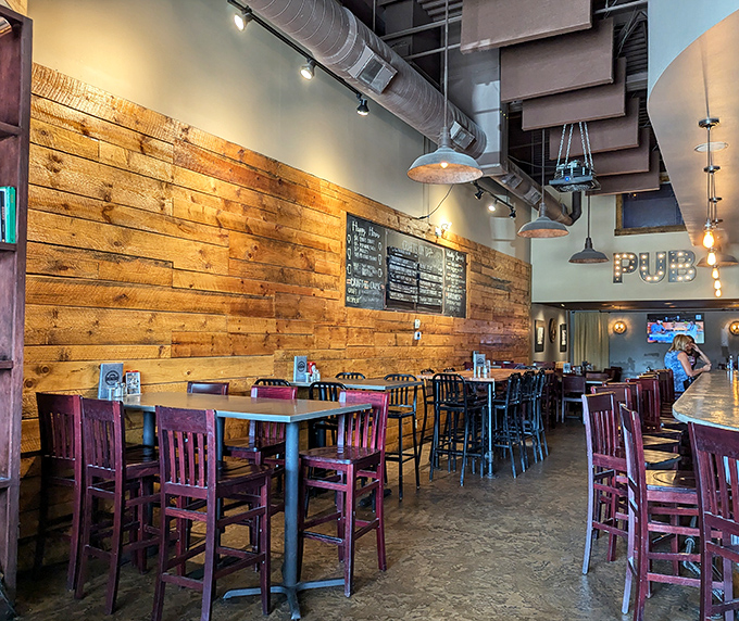 Reclaimed wood meets industrial chic in a space that prioritizes comfort over pretense—perfect for serious eating.
