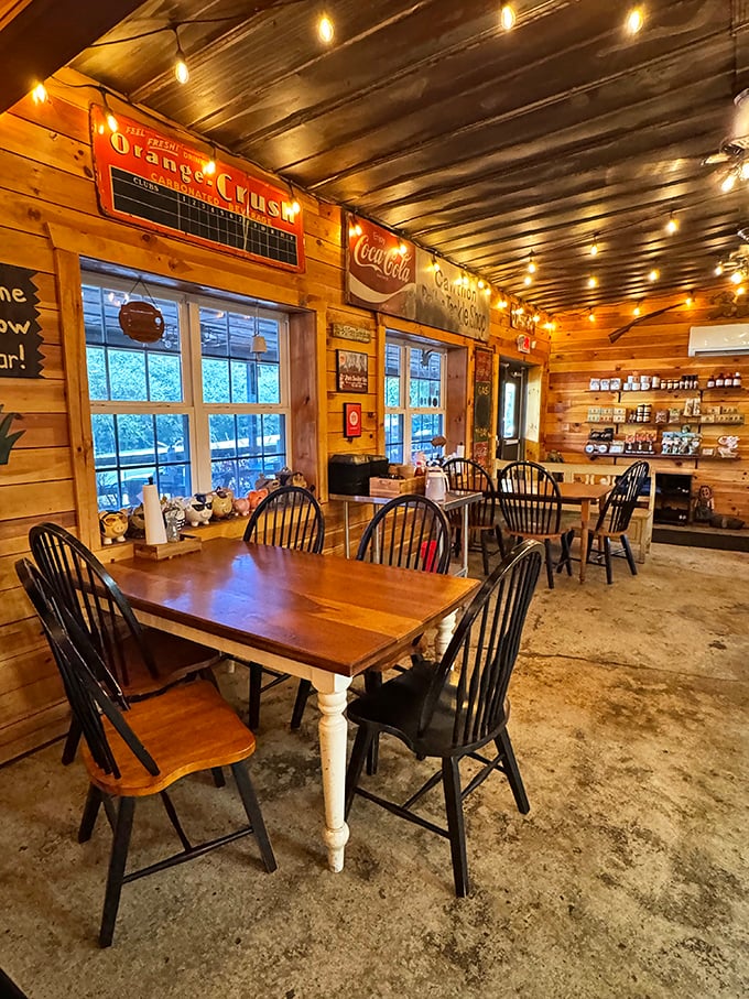 Warm wooden walls adorned with vintage signs create the perfect backdrop for barbecue bliss. No designer needed—just decades of smoke and stories.