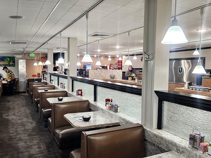 Classic diner aesthetics done right—comfortable booths, counter seating, and lighting that says "good morning" without shouting it at your hangover.