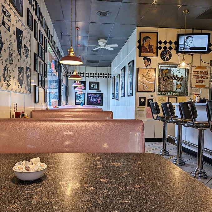 Pink booths and vintage memorabilia create the perfect time capsule interior. Elvis and Marilyn silently approve of your breakfast choices.