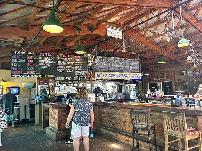 Where orders are placed, memories are made. The chalkboard menu and exposed beams tell you this place prioritizes substance over style.