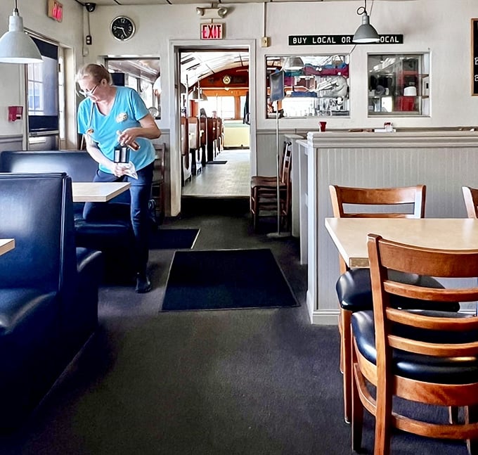 Classic booths, simple tables, and that "Buy Local or Bye Local" sign—this is New Hampshire's answer to comfort. No pretension, just honest hospitality.
