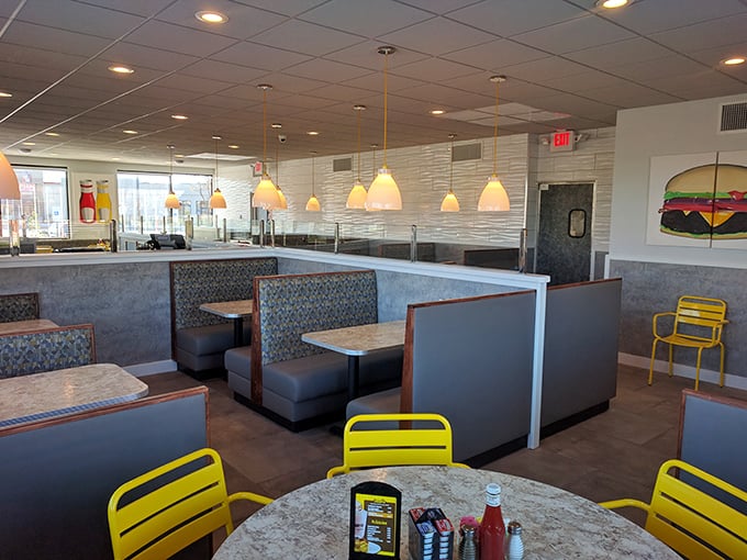 Classic diner comfort meets modern cleanliness inside Pop's. Those yellow chairs aren't just seating—they're sunshine you can sit on after a rough morning.