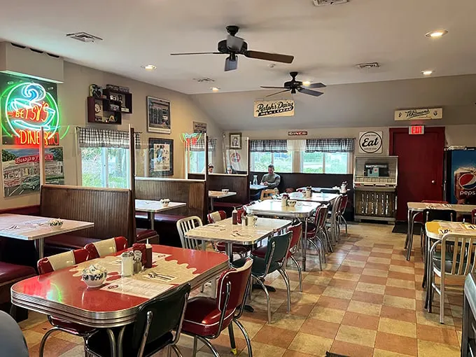 Step inside and time-travel to the 1950s. The checkerboard floor and red vinyl booths aren't trying to be retro—they're the real deal.