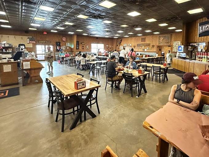 No-frills dining at its finest—concrete floors, wooden tables, and the invisible but unmistakable perfume of decades of smoke.